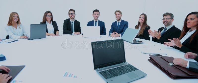 Side View of Smilimg Business Team, Sitting at a Round Table on Stock ... Side View of Smilimg Business Team, Sitting at a Round Table on Stock ...
