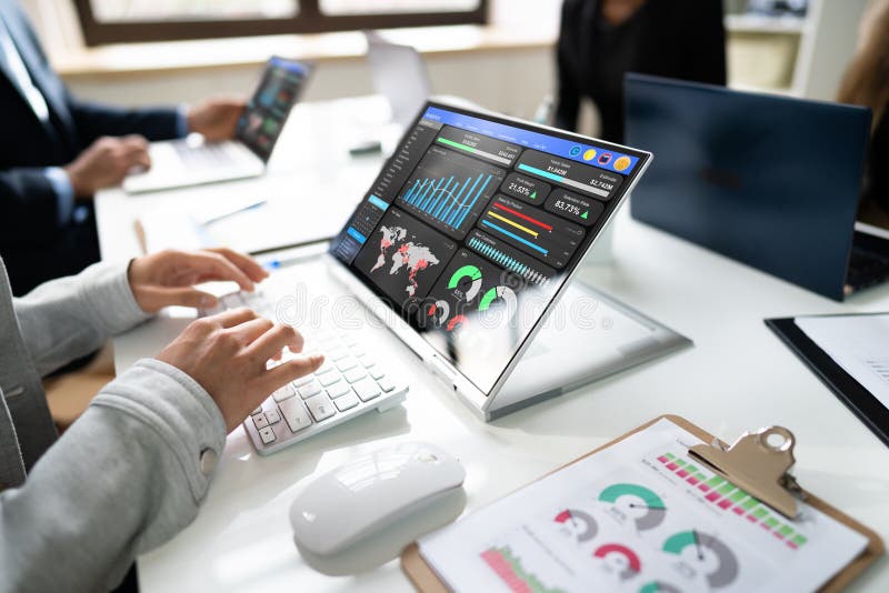 Side View of Businesspeople Examining Graph on Computer Stock Image ...