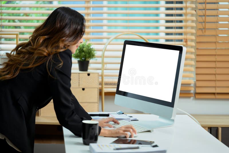 Side View of Businesswoman Standing in Her Office and Working with ...