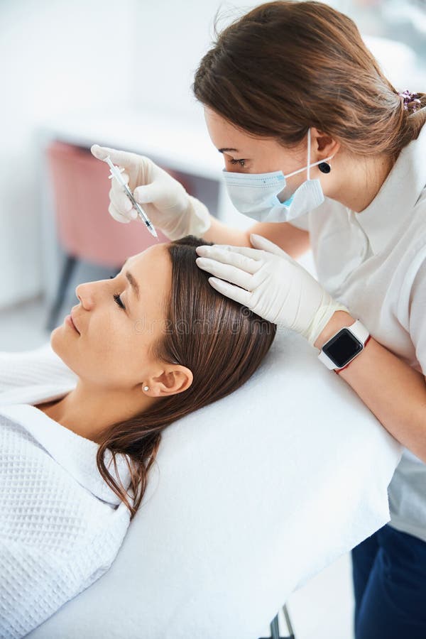 Woman Getting an Injection into the Forehead Stock Image - Image of ...