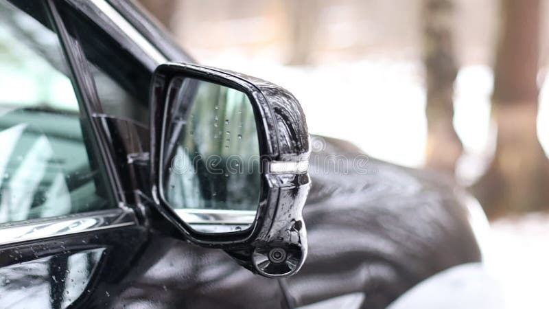 The Side-view Camera is Installed in the Side Mirror of a Black Car ...