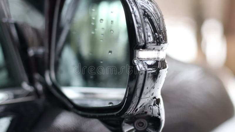 The Side-view Camera is Installed in the Side Mirror of a Black Car ...