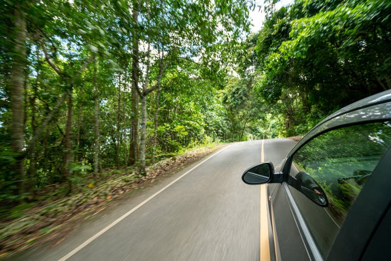 Side View of Car Driving on Road in Forest Highway Stock Image - Image ...