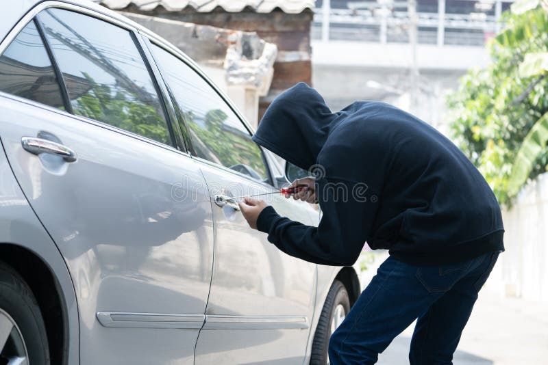 Side View of Car Thief in Action Stock Photo - Image of mask, crime ...