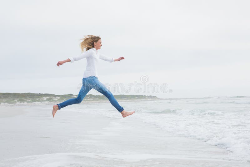 Side View of a Casual Woman Jumping at Beach Stock Image - Image of ...