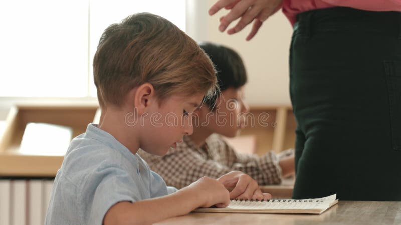 Side View of Caucasian Student Looking a Note and Answer Question ...