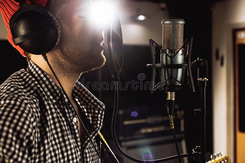 Side View on Caucasian Young Man Singing in Studio Stock Image - Image ...
