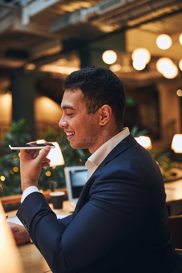 Young Businessman Using the Loudspeaker Mode on His Cellphone Stock ...