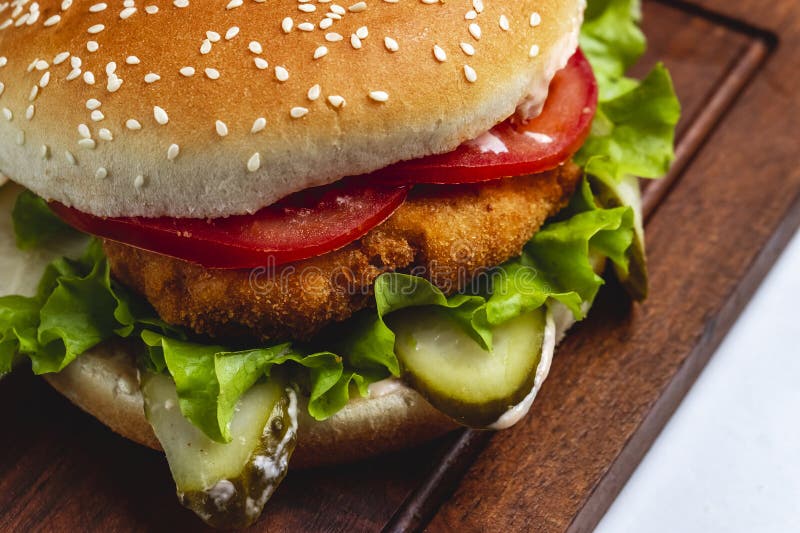 Side View Chicken Burger with Sliced â€‹â€‹tomato and Lettuce on the ...