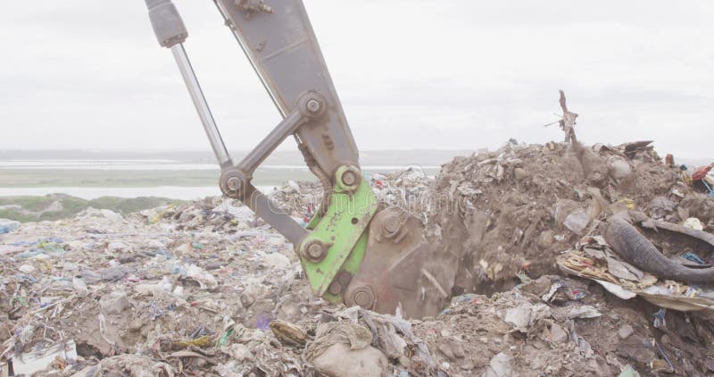Digger Clearing Rubbish Piled on a Landfill Full of Trash Stock Video ...