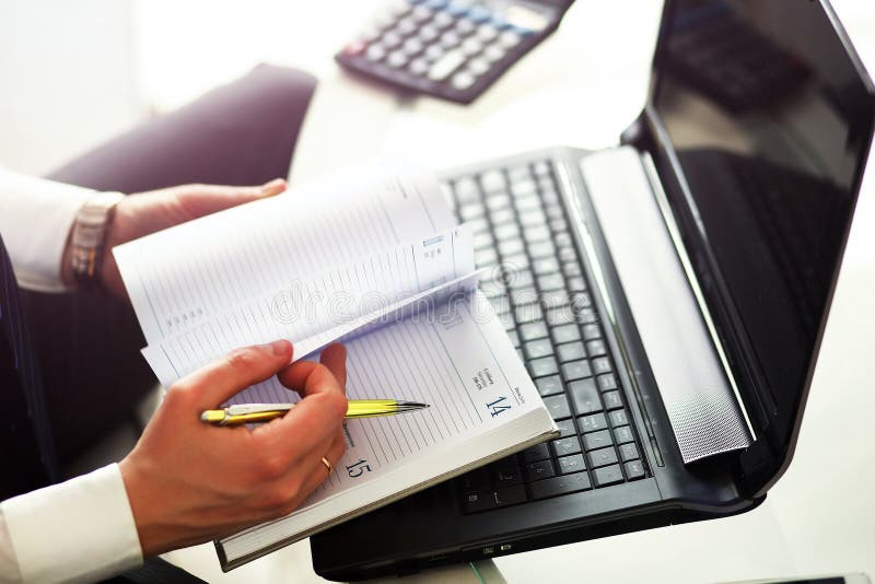 Side View and Close Up of Man`s Hands Using Laptop and Notepad. Working ...
