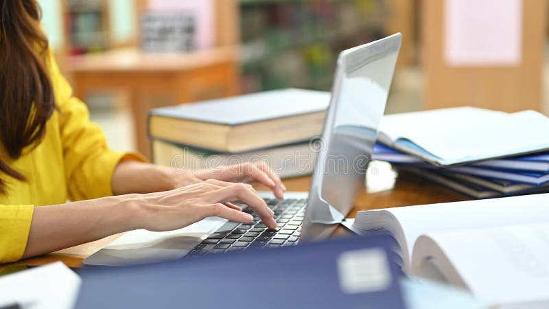 Side View of College Students Hands Typing on Keyboard of Laptop ...