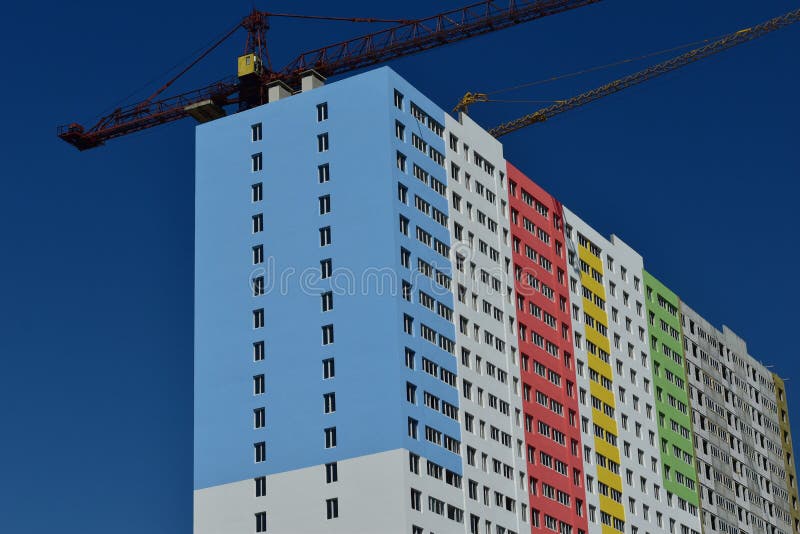 Side View of a Colorful High-rise Building Being Built with a Tower ...