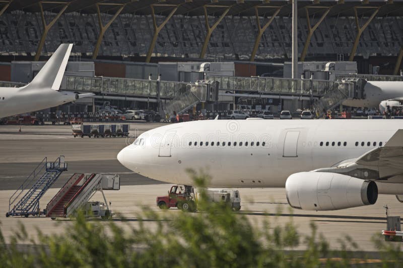 Side View of a Commercial Airplane Crossing a Runway Illuminated Stock ...