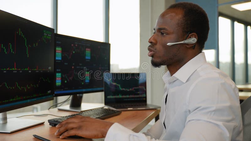 Concentrated African Crypto Trader Sitting in Front of Computers ...
