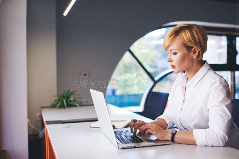 Serious Woman Secretary Doing Work on Modern Laptop Stock Photo - Image ...