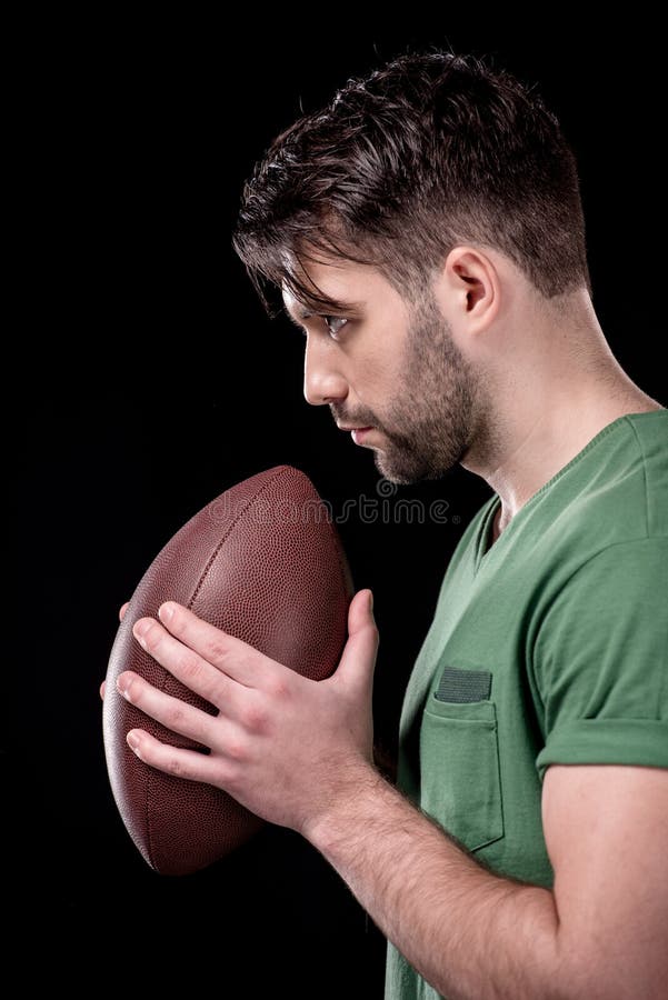 Side View of Concentrated Man Holding Rugby Ball Stock Image - Image of ...