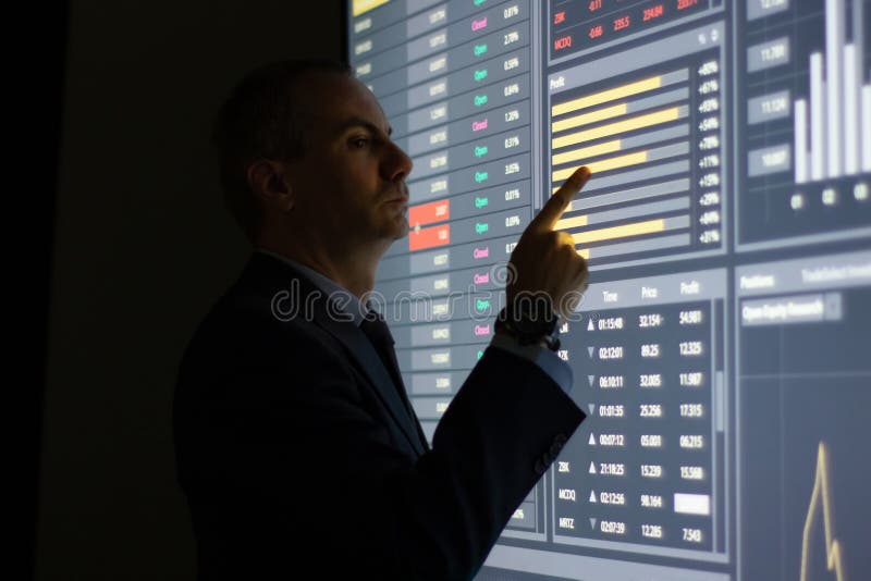 Side View of Corporate Financier Using Charts Stock Photo - Image of ...