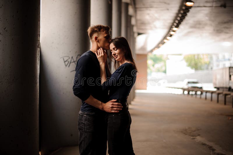 Side View of Couple Standing and Hugging Stock Image - Image of couple ...