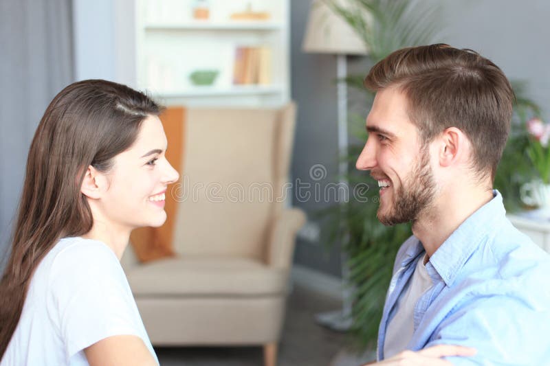 Side View of a Couple Talking Sitting on a Couch and Looking Each Other ...