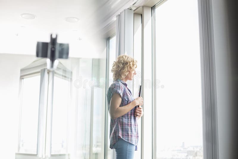 Side View Creative Businesswoman Holding Files Looking Window Office ...
