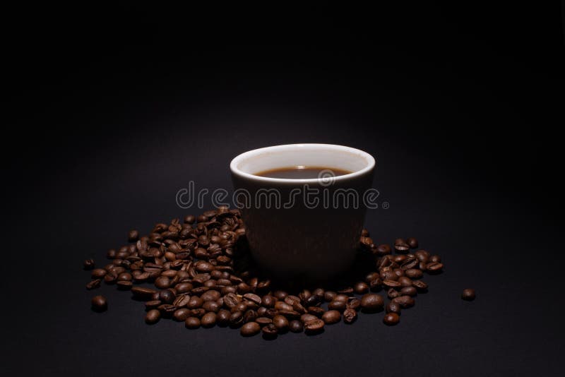 Side View of a Cup with Coffee and Coffee Beans with Top Lighting Stock ...