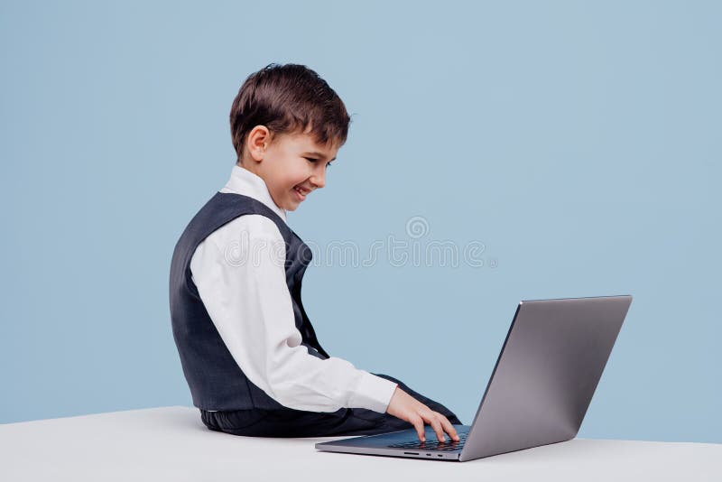 Side View of Curious Little Boy Typing on Laptop Stock Image - Image of ...