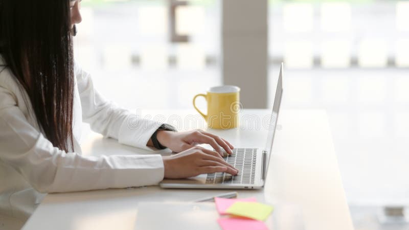 Side View of Customer Service Talking on Headset in Call Centre ...