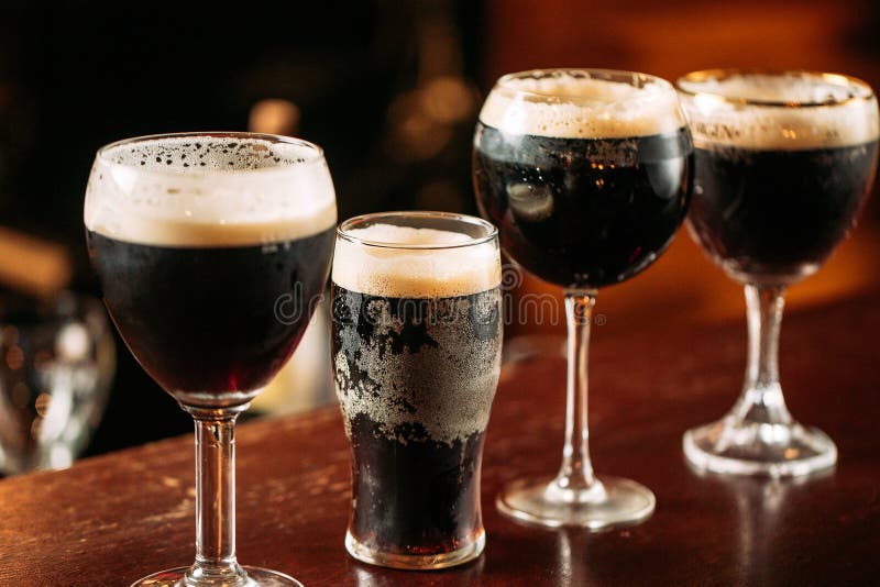 Side View on Differend Glasses with Dark Beer Stock Image - Image of ...