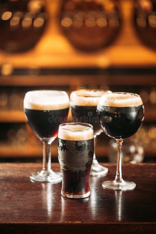Side View on Differend Glasses with Dark Beer Stock Image - Image of ...