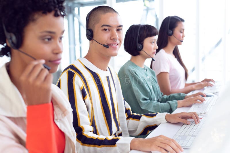 Customer Service Executives Working on Computer at Desk Stock Image ...