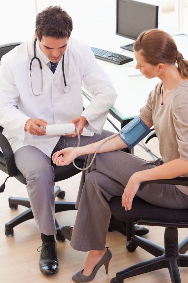 Side View of Doctor Taking His Patients Blood Pressure Stock Image ...