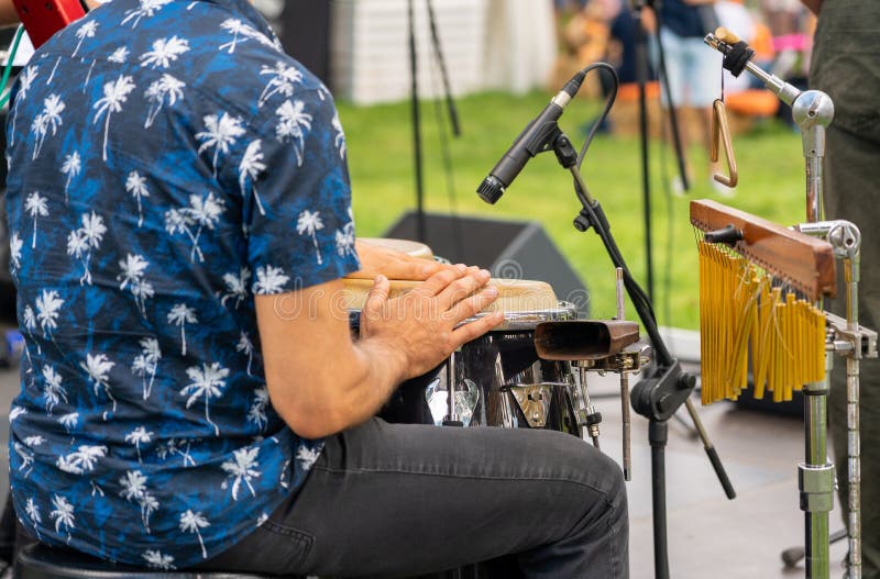 Side View of a Drummer Playing Drums with His Hands on the Stage Close ...