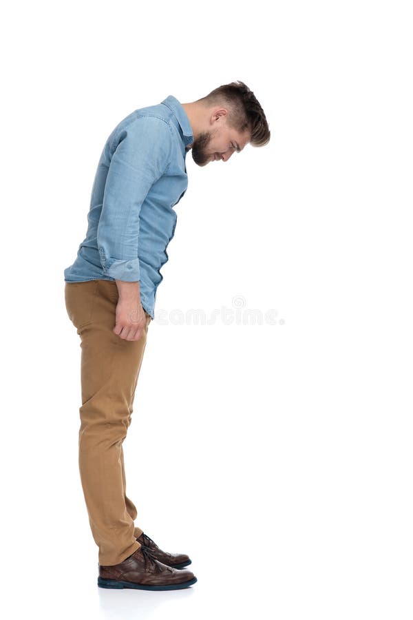 Side View of a Eager Casual Man Curiously Looking Down Stock Photo ...