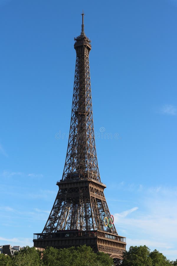 Side View of the Eiffel Tower with Olympic Rings Stock Image - Image of ...