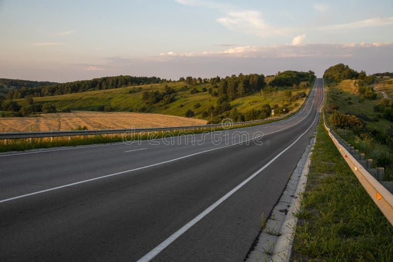 Empty Road on Hill at Sunset Stock Photo - Image of asphalt, outdoor ...
