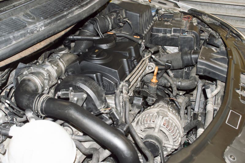 Side View of the Engine Compartment of a Car with a Three-cylinder ...