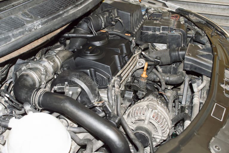 Side View of the Engine Compartment of a Car with a Three-cylinder ...