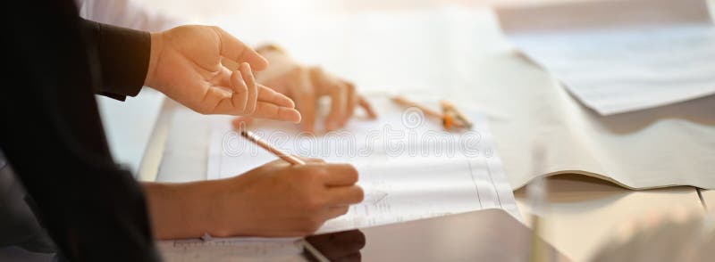 Side View of Engineer Man Hand Drawing on Blueprint and Briefing with ...