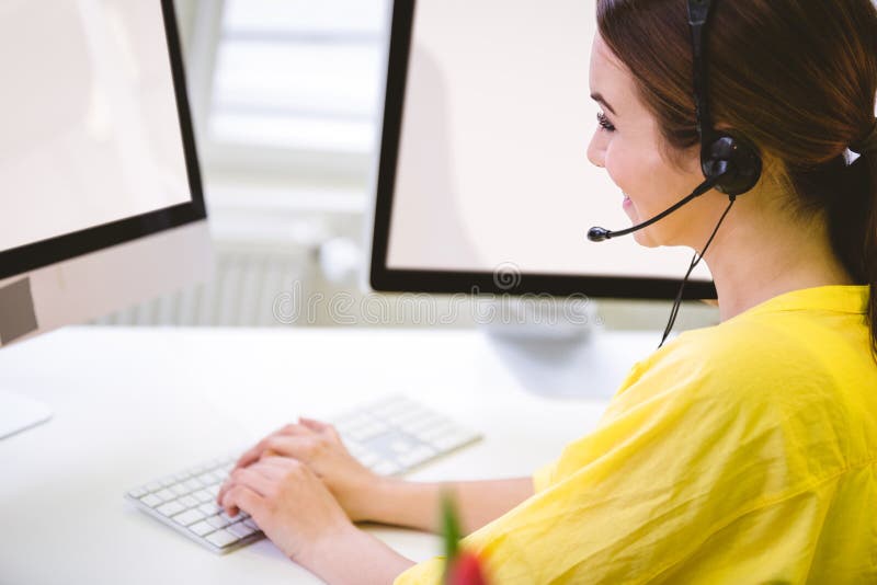 Side View of Executive Multi-tasking at Creative Office Stock Image ...