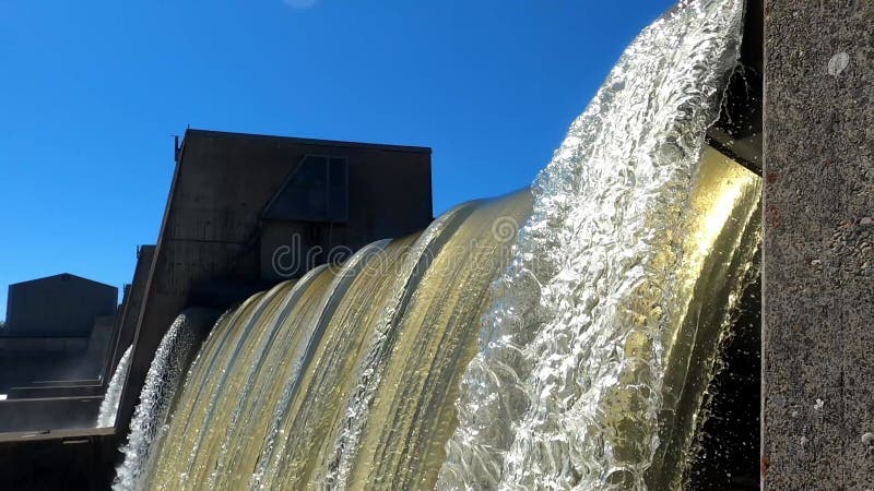 Side View of Falling Dam Water Foam Falling with Blue Sky on in the ...