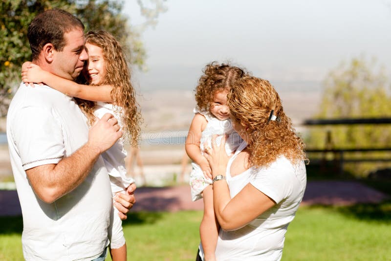 Side View of a Family in the Park Stock Photo - Image of laughter ...
