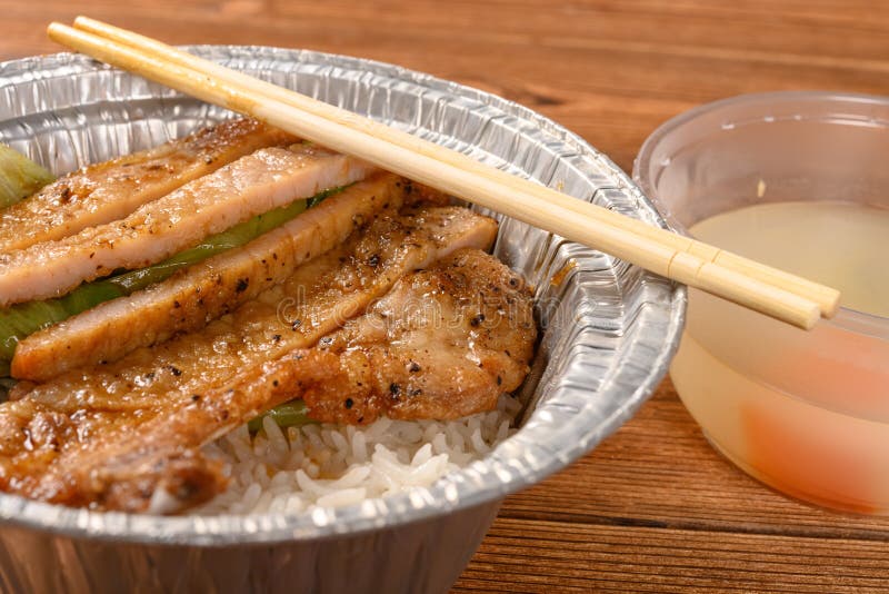 Side View Fast Food of Grilled Pork and Cabbage and Rice with Bowl of ...