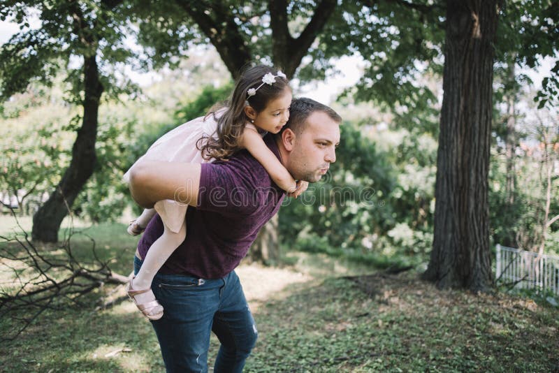 Back of Father Carrying His Daughter on Back Stock Photo - Image of ...