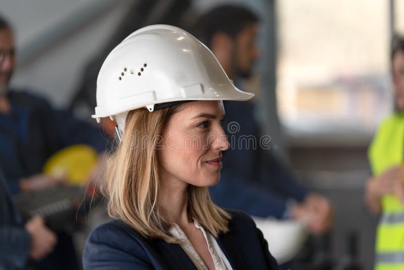 Side View of a Female Chief Engineer in Modern Industrial Factory ...