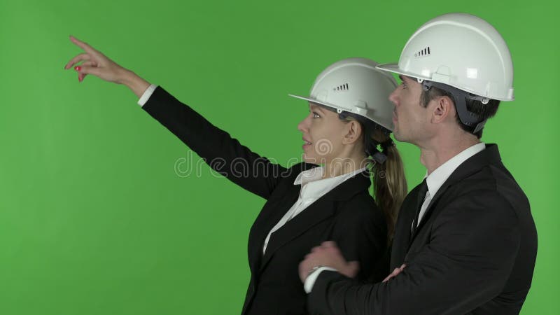 Side View of Female Construction Engineer Pointing Up Standing with ...