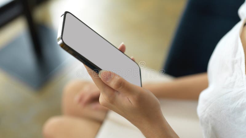 Side View of Female Hand Holding Smartphone with Mock-up Screen in ...