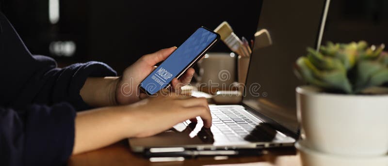 Female Hand Using Smartphone and Laptop on Wooden Table Stock Image ...