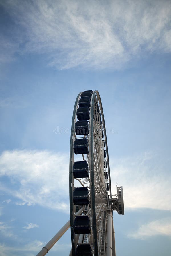 Side View of Ferris Wheel Against Blue Sky Stock Image - Image of ...
