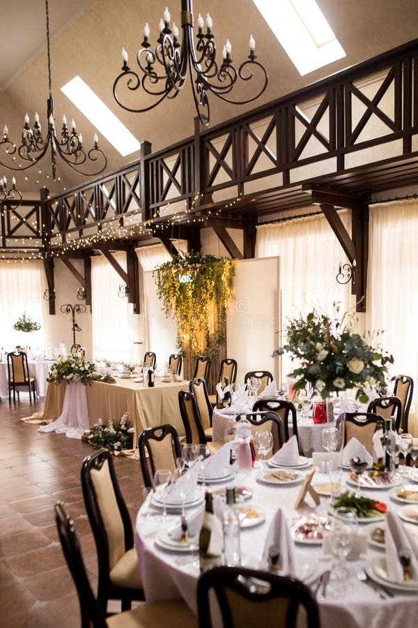 Side View of Festive Table Setting with Wine Glasses, Fresh Flowers and ...